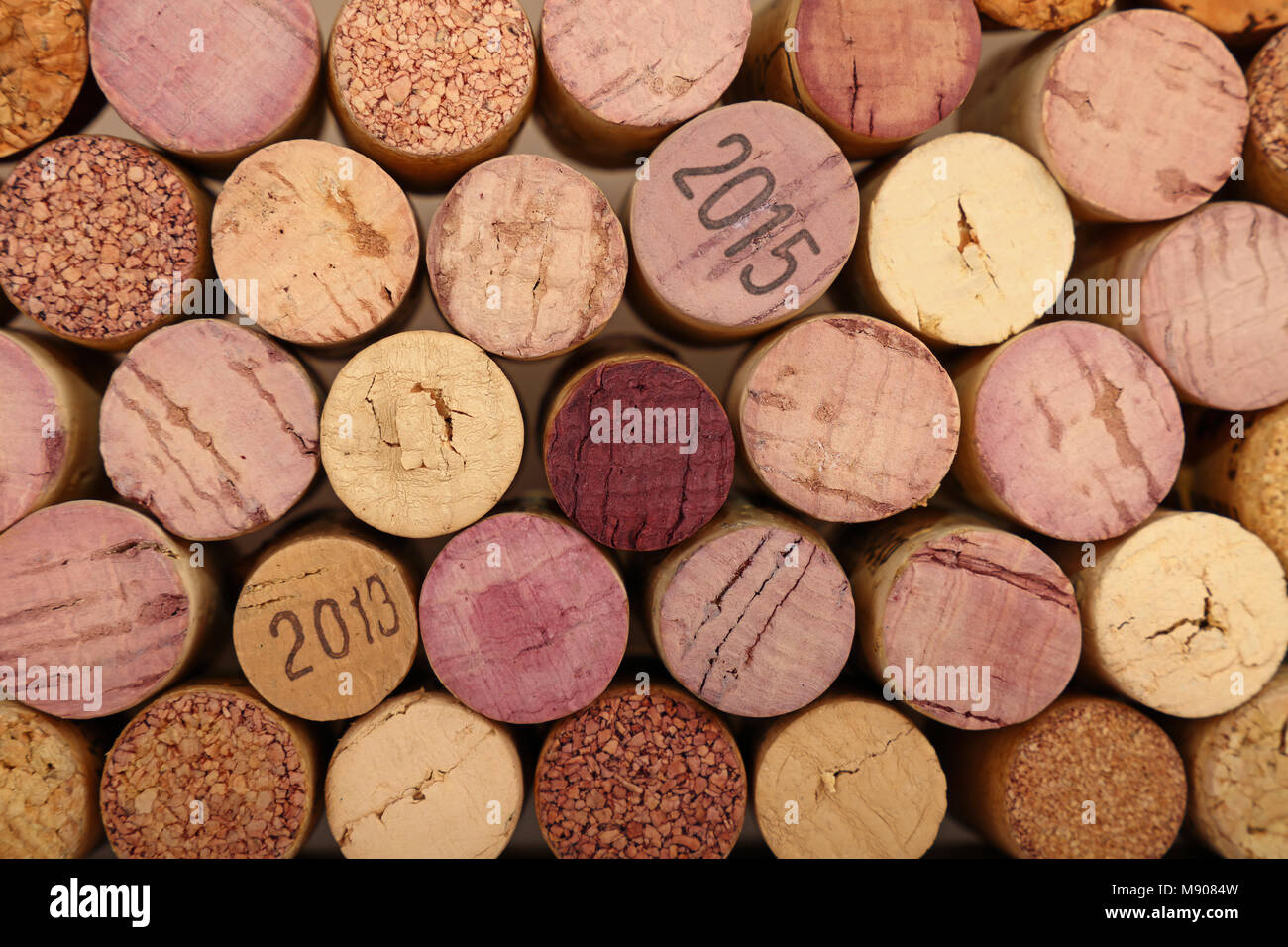 Close up background pattern of many assorted stacked used red wine ...