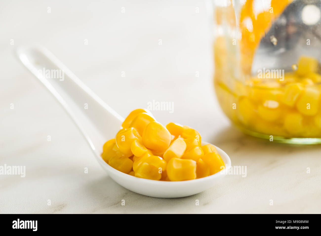 Spoon with corn seeds hi-res stock photography and images - Alamy