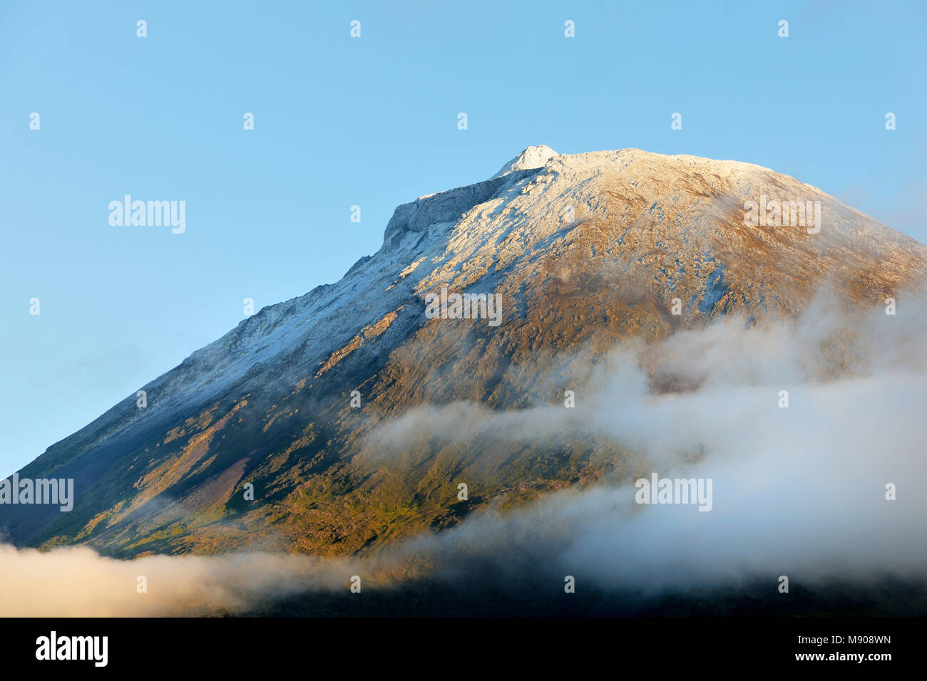 The volcano covered with snow, 2351 meters high, at the Pico island ...