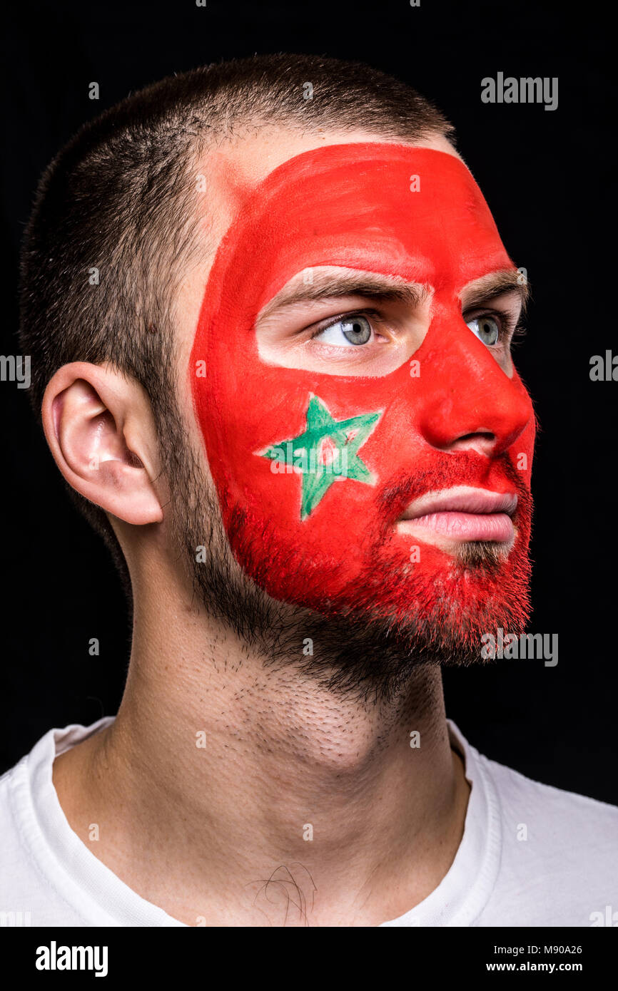 Portrait of handsome man face supporter fan of Morocco national team ...