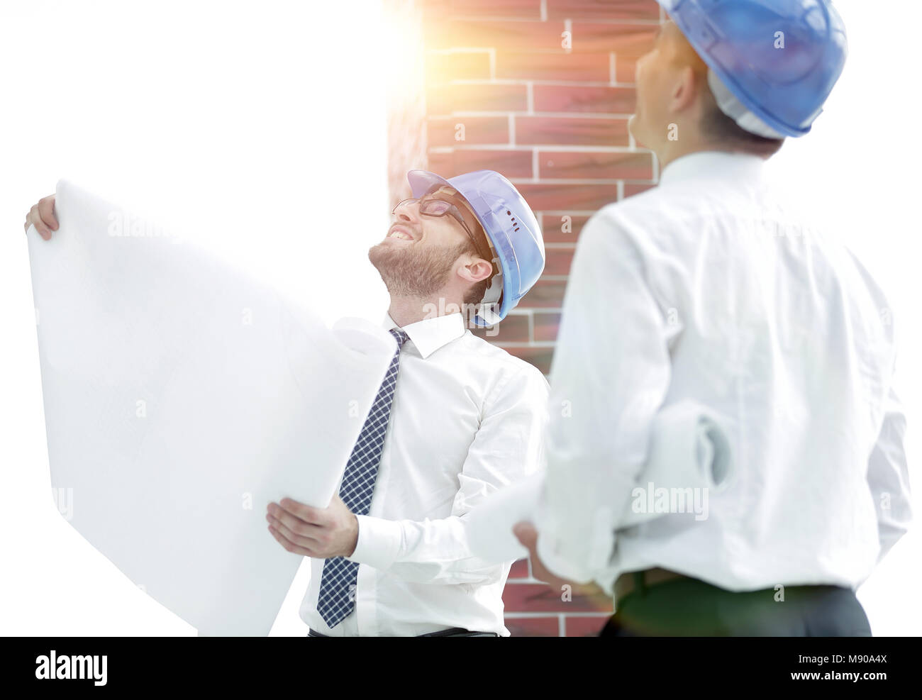 Builder foreman looking paper house hi-res stock photography and images ...