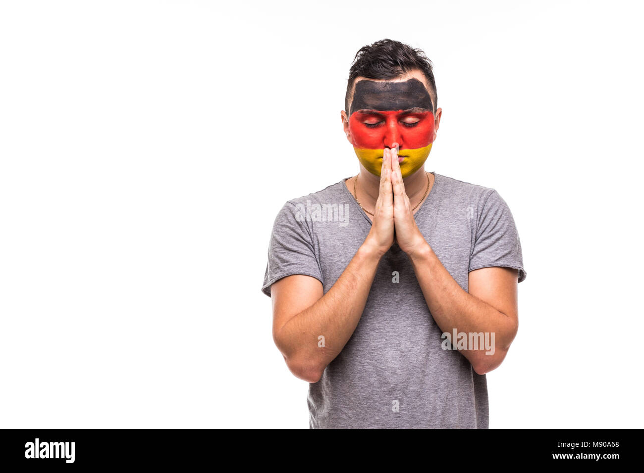 Handsome man supporter loyal fan of Germany national team with painted ...