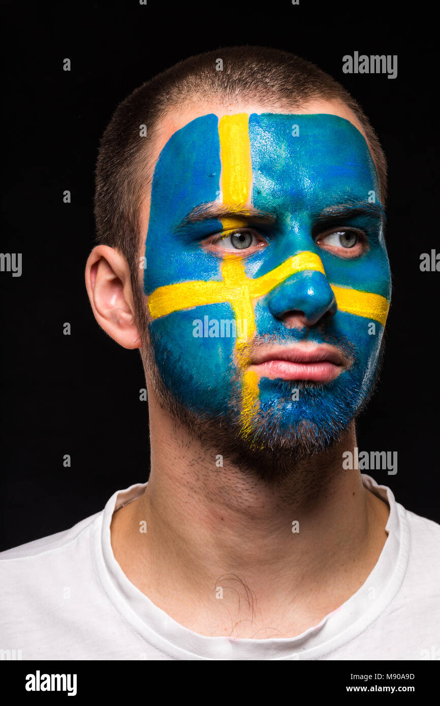 Portrait of handsome man face supporter fan of Sweden national team ...