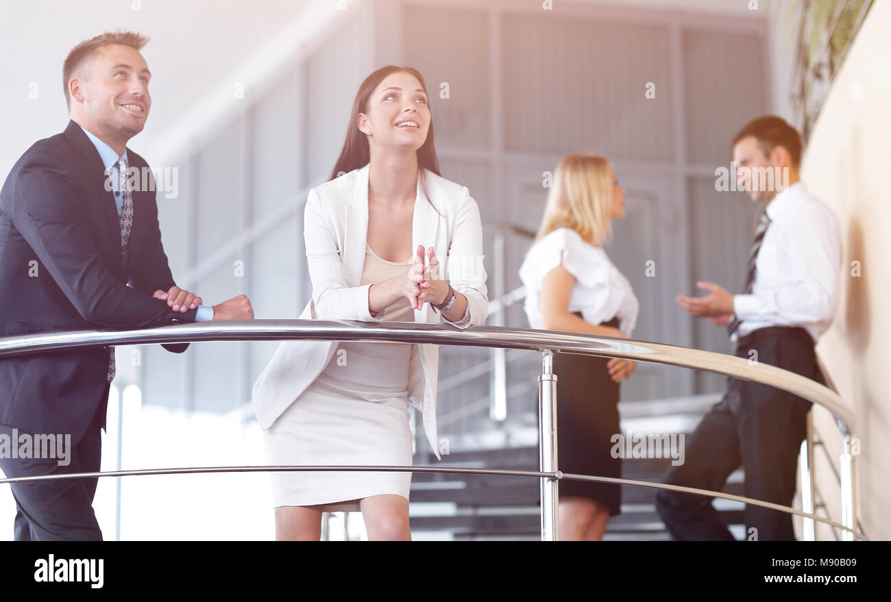 business team in a break from work, standing on the terrace of the ...