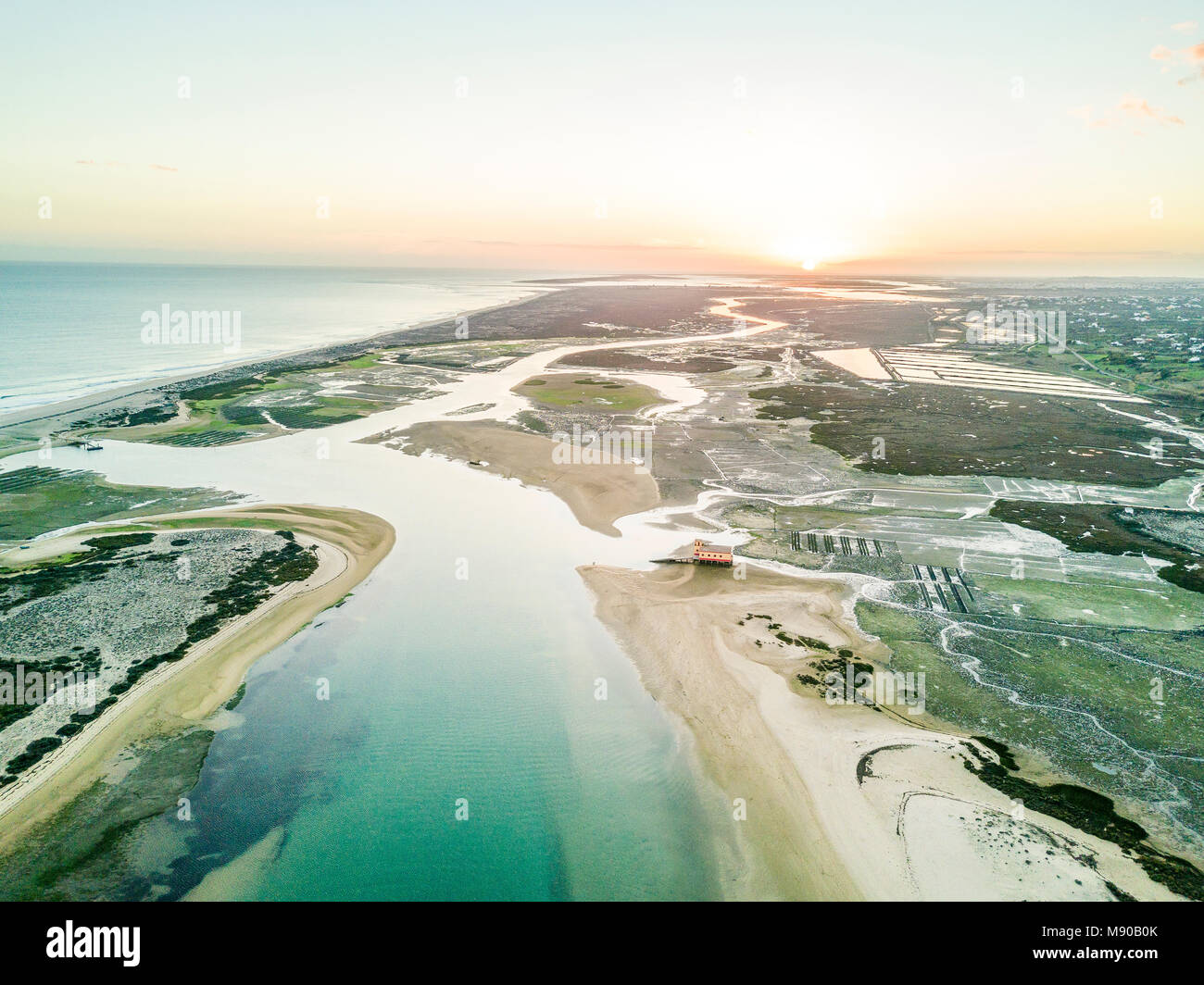 Aerial view of unique Ria Formosa at sunset in Fuseta, Algarve ...