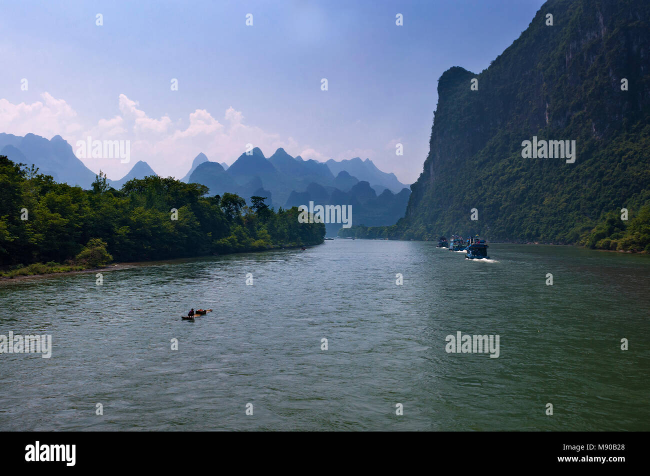Yangshuo, China - August 1, 2010: A traditional raft and boats with ...