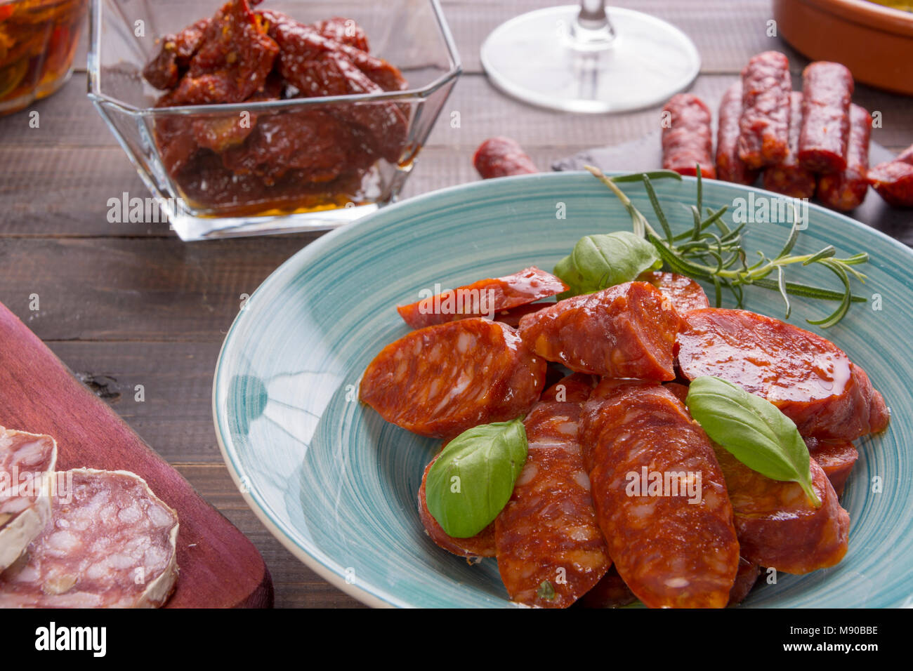 Chorizo sausage on blue plate Stock Photo - Alamy