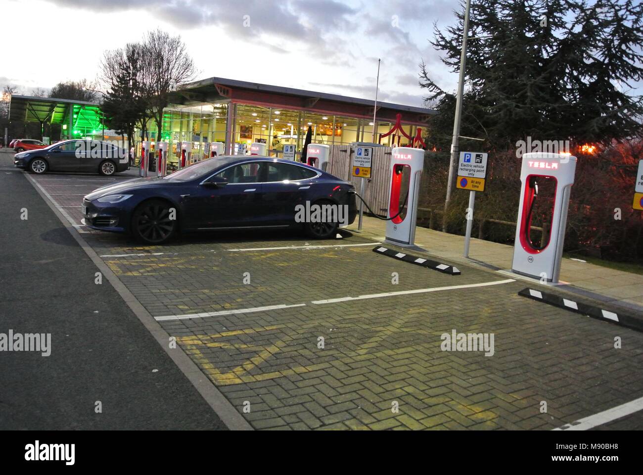 Hybrid, Electric Cars at charging point Stock Photo - Alamy
