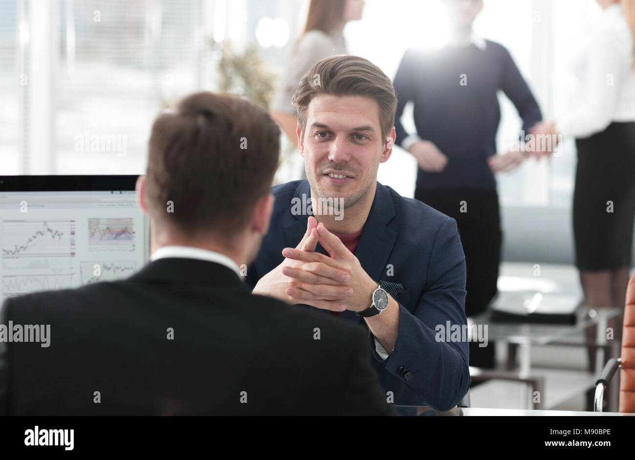Two men discuss in the workplace. office life Stock Photo - Alamy