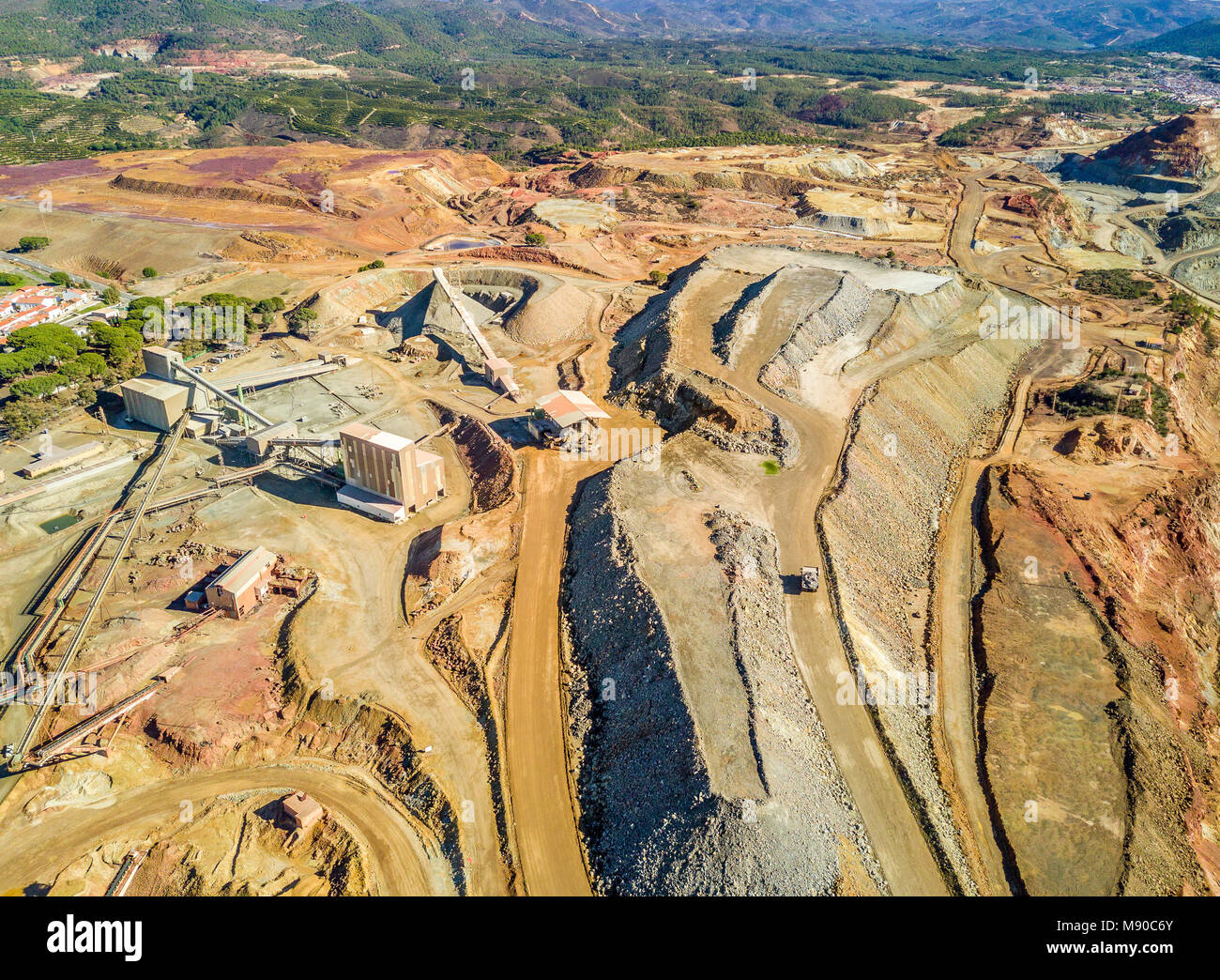 Aerial view of huge, modern open pit mine in Minas de Riotinto ...