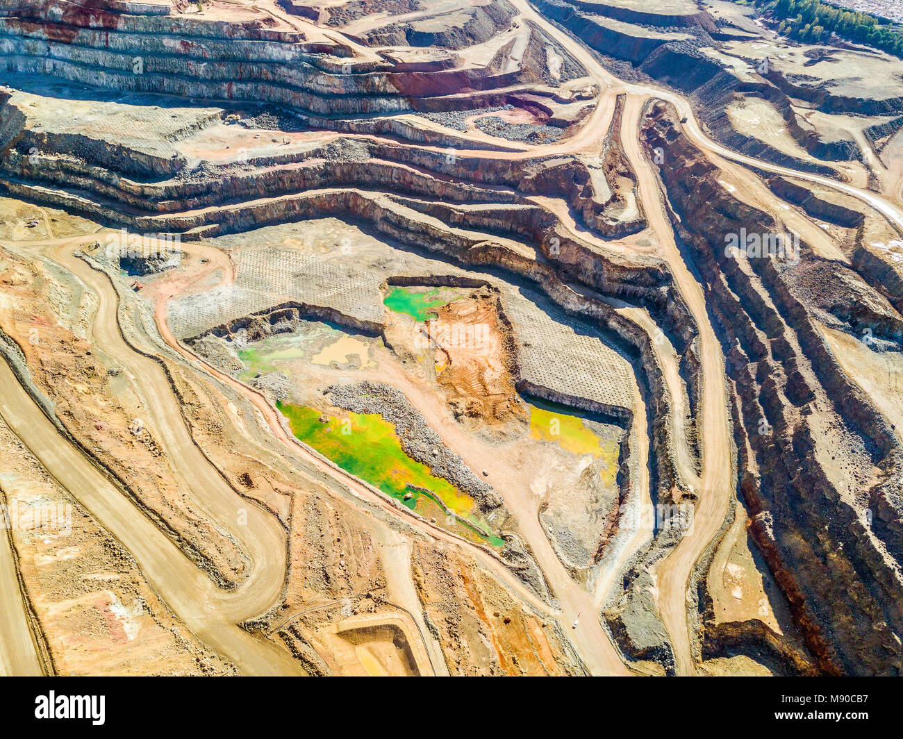 Aerial view of huge, modern open pit mine in Minas de Riotinto ...