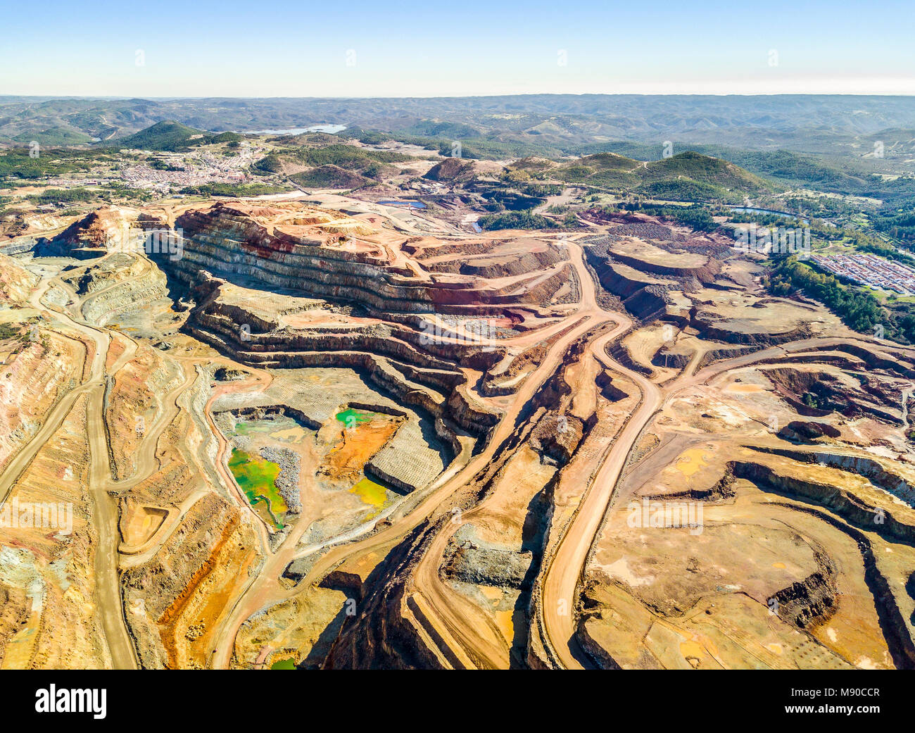 Aerial view of huge, modern open pit mine in Minas de Riotinto ...