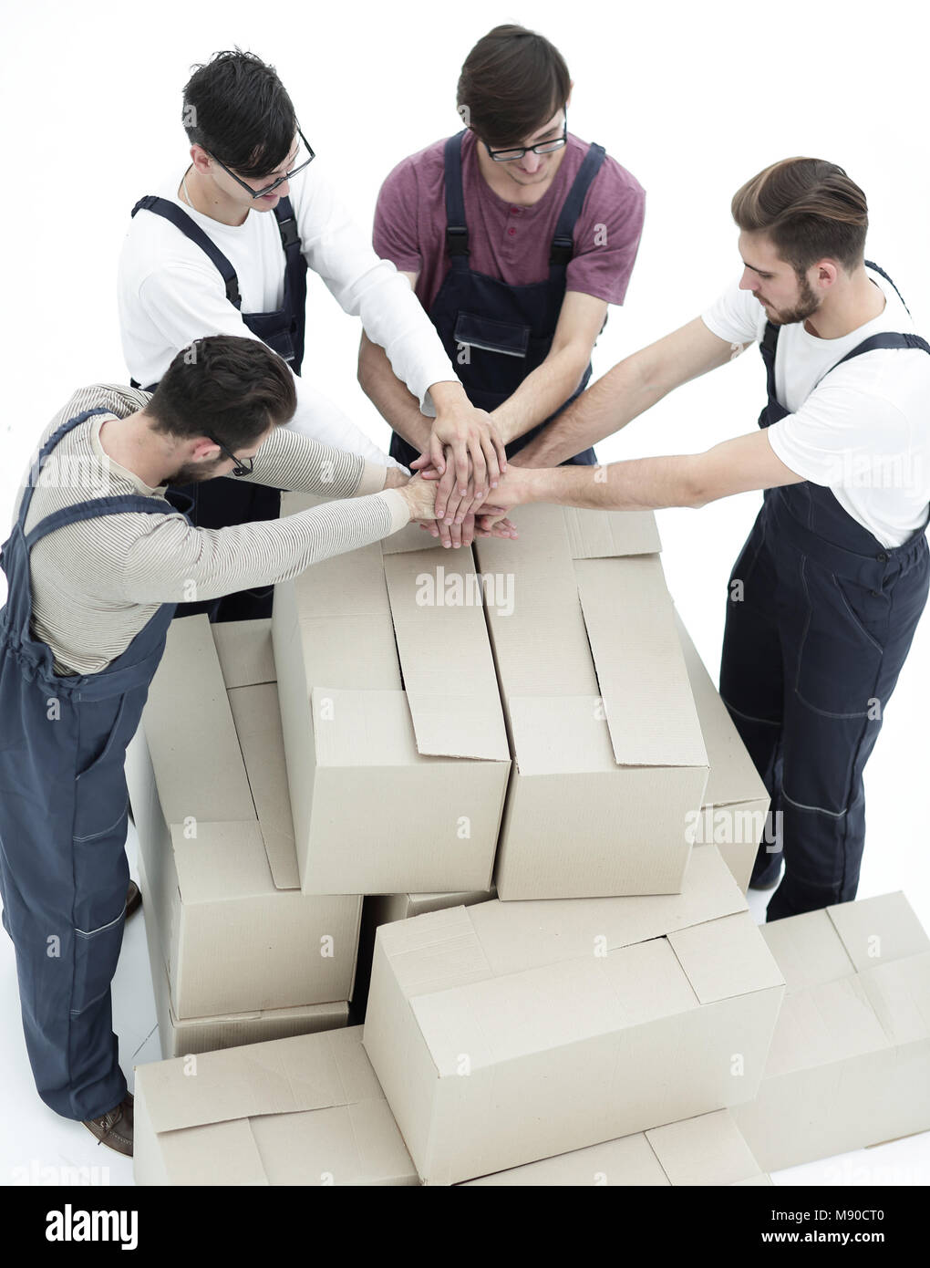 Delivery men carrying stack of boxes. Isolated on white Stock Photo - Alamy