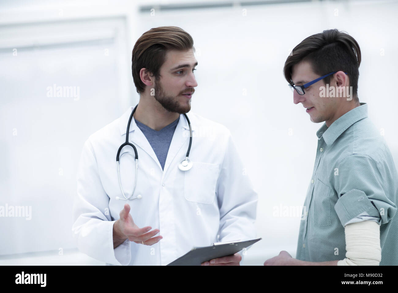 doctor gives advice to his patient Stock Photo - Alamy