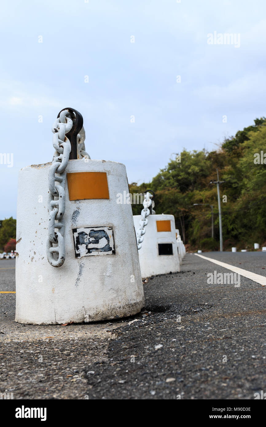 chain fences and cement block Stock Photo - Alamy