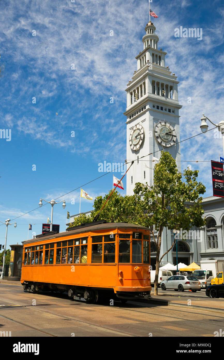 The Ferry Building Clocktower stand in the San Francisco Skyline an ...
