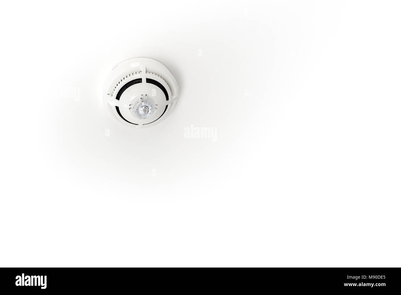 Smoke alarm in white Cut Out Stock Images & Pictures - Alamy
