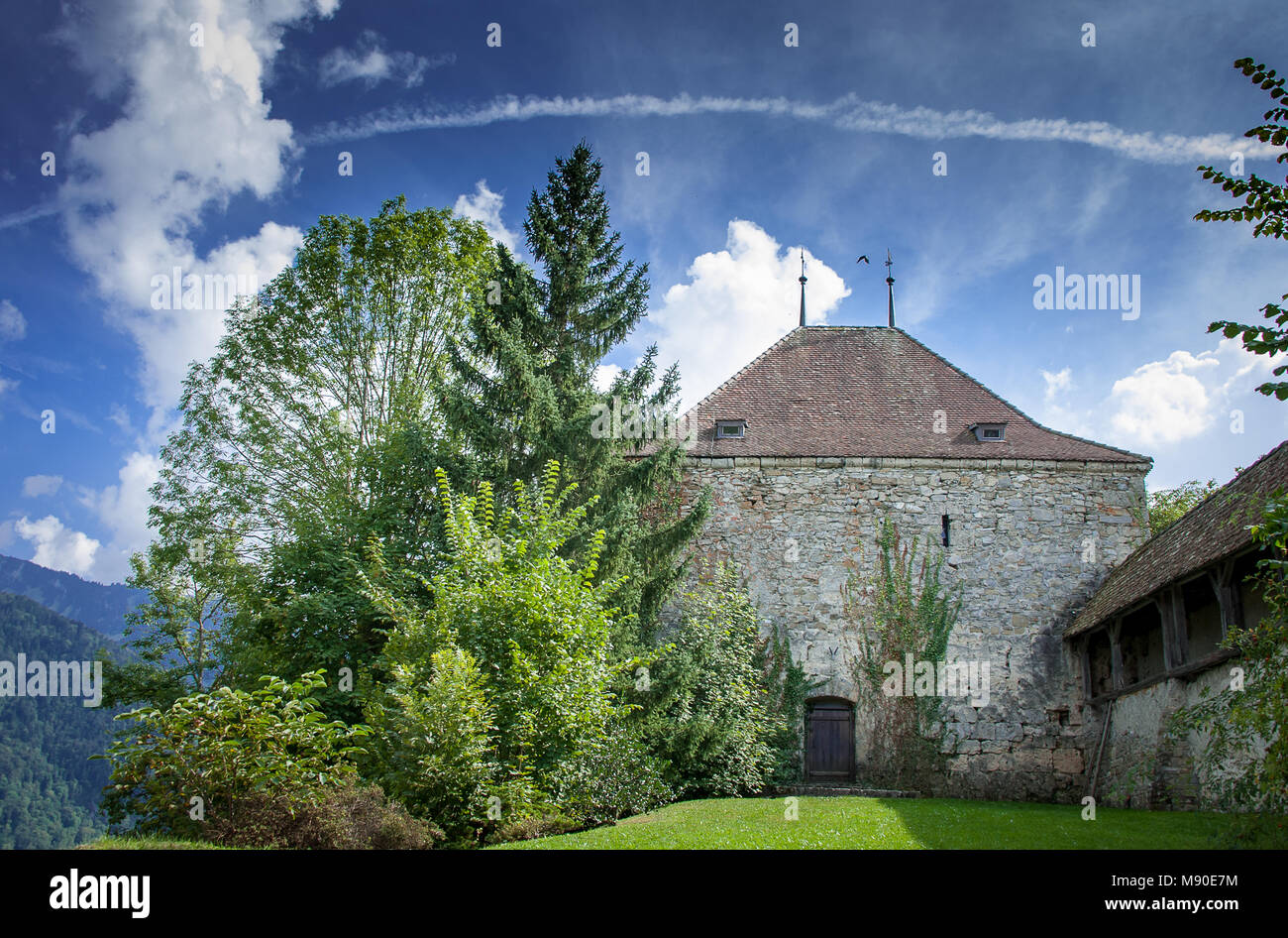 Old stone wall building in Gruyere medieval town, Switzerland ...