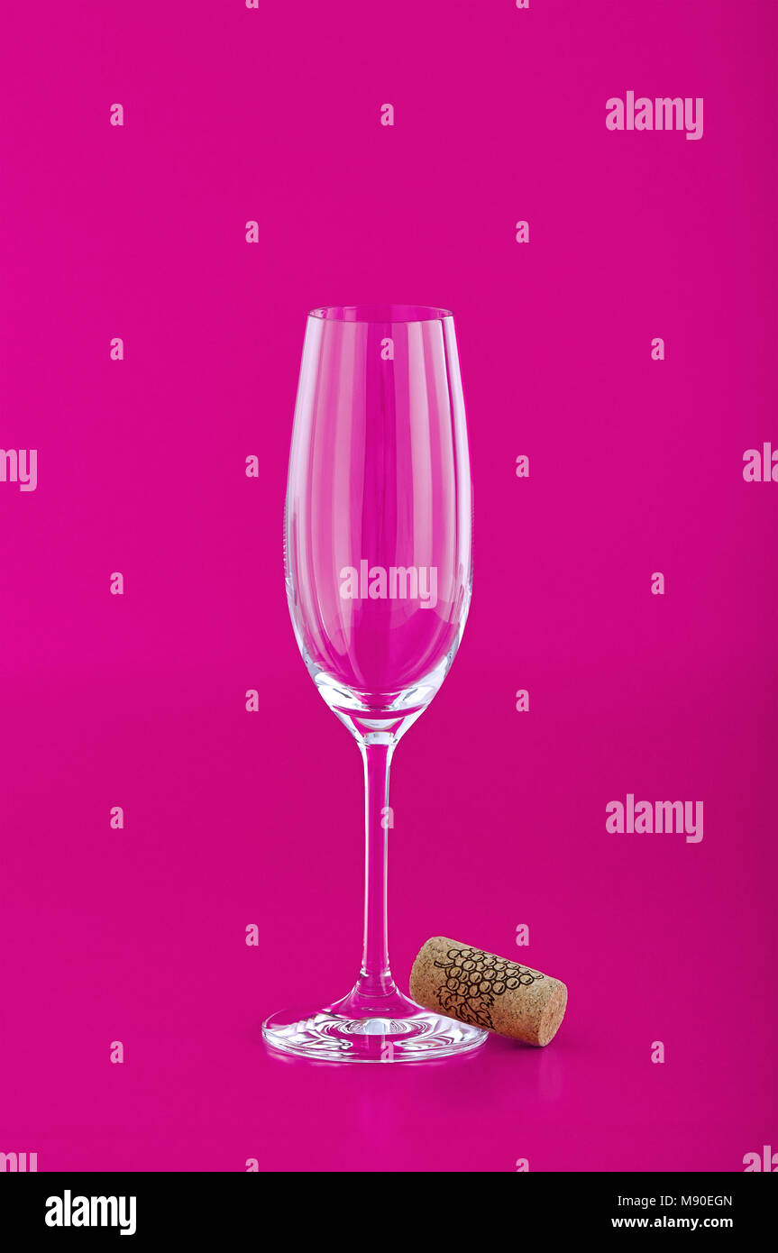 Wine glass with cork on pink Stock Photo - Alamy