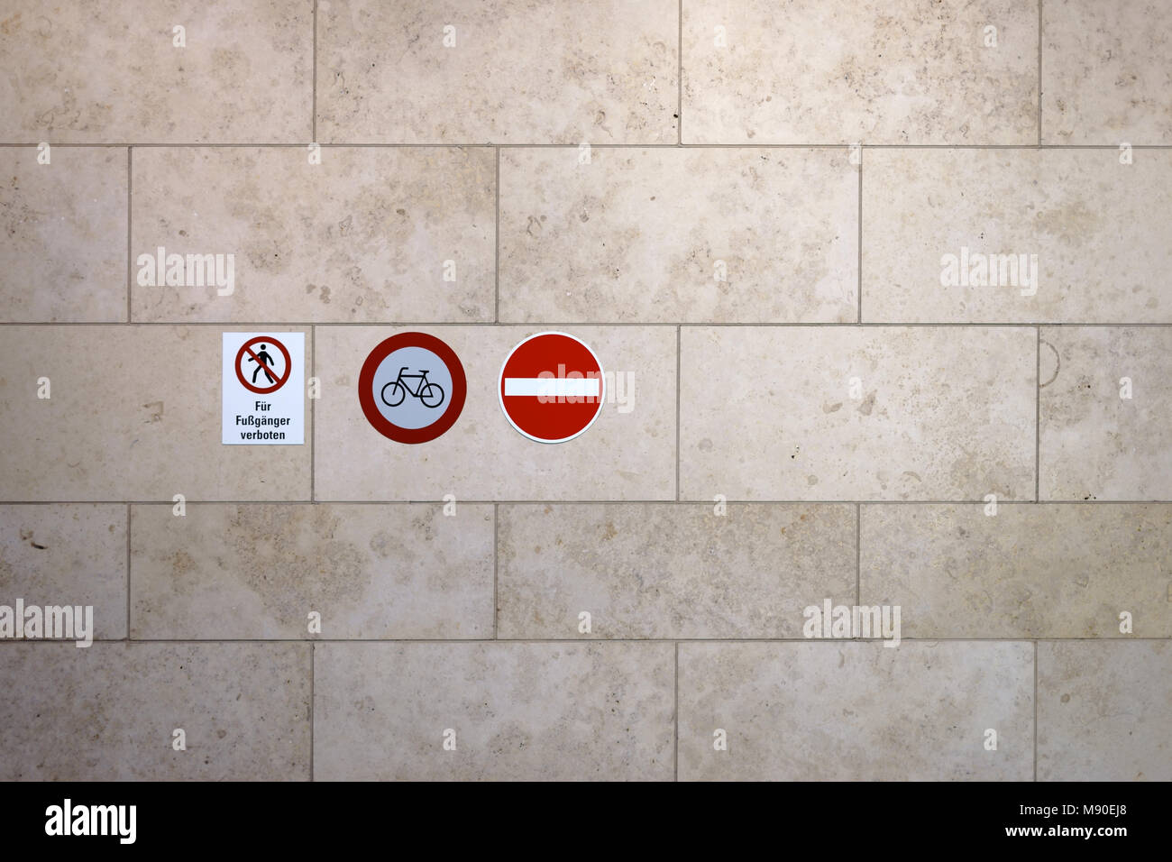 Red traffic signs such as passage forbidden on a marble wall Stock ...