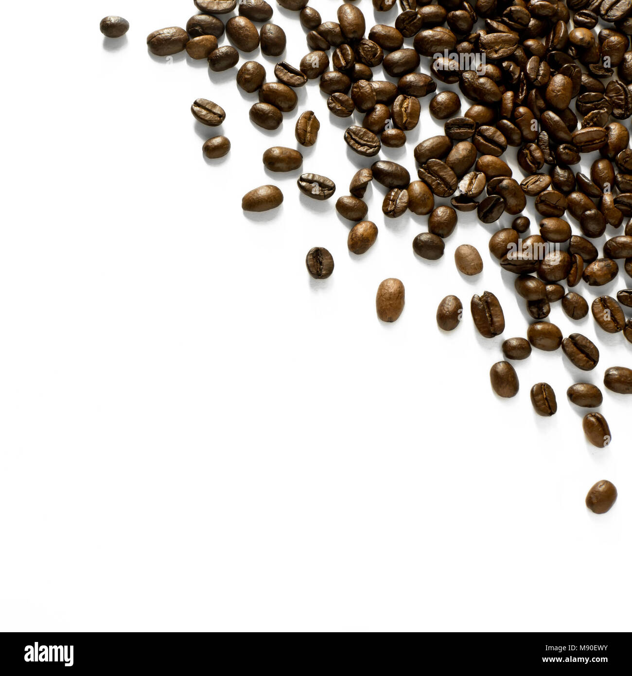 Arrangement of scattered coffee beans isolated on white - corner design ...
