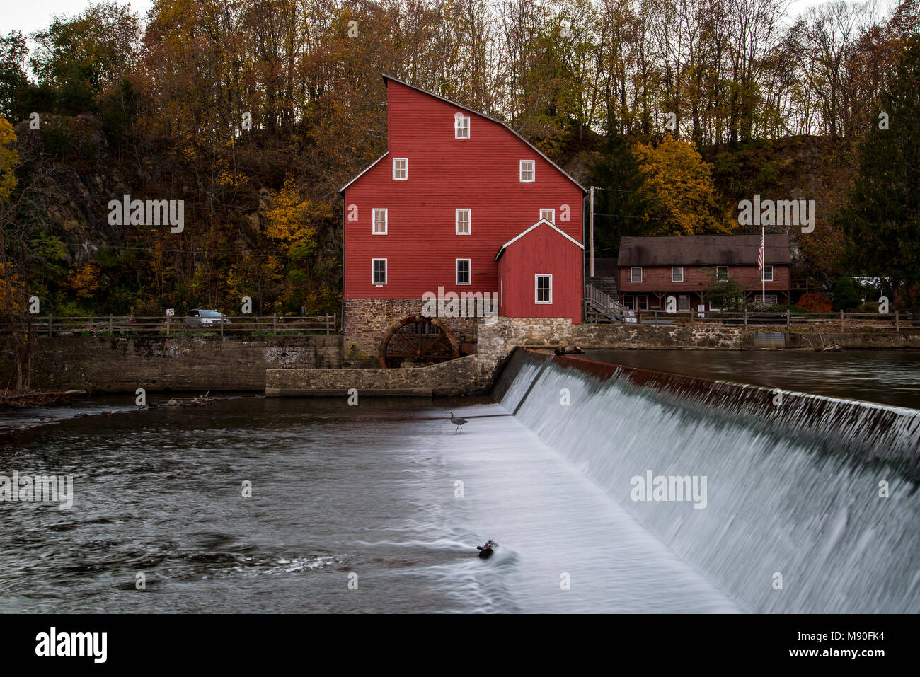 Red mill and a waterfall Stock Photo - Alamy