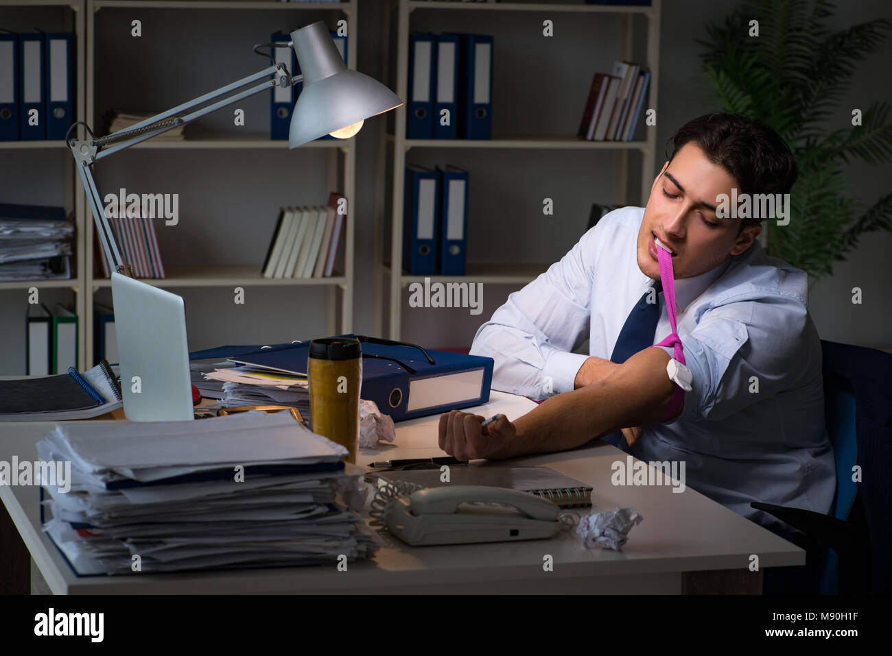 Employee relieving stress from overtime with drugs narcotics Stock ...
