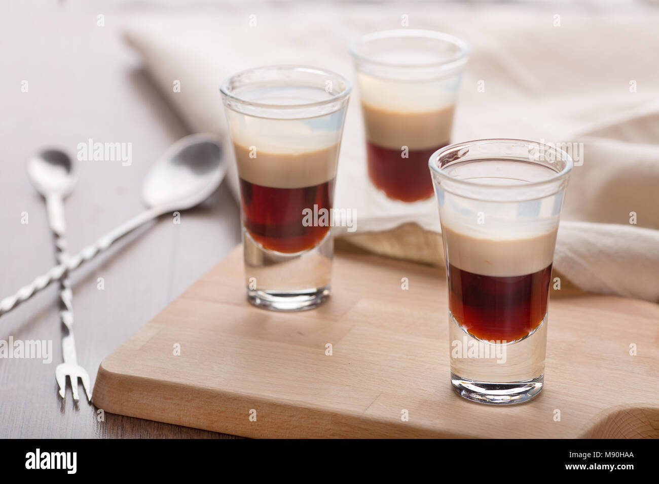 Layered cocktail of coffee liqueur Stock Photo - Alamy