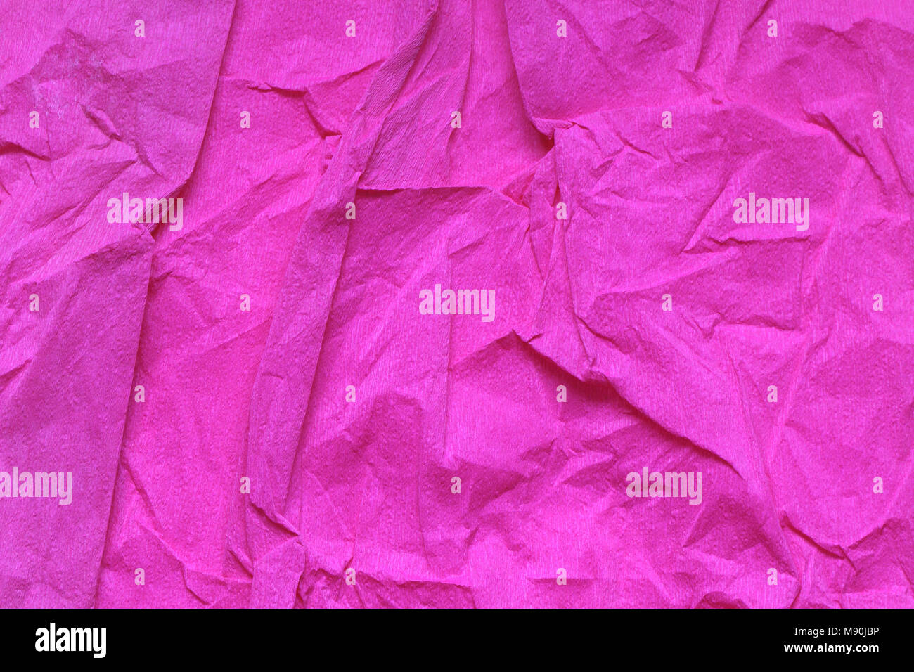 Background made from sheet of crushed pink paper Stock Photo - Alamy
