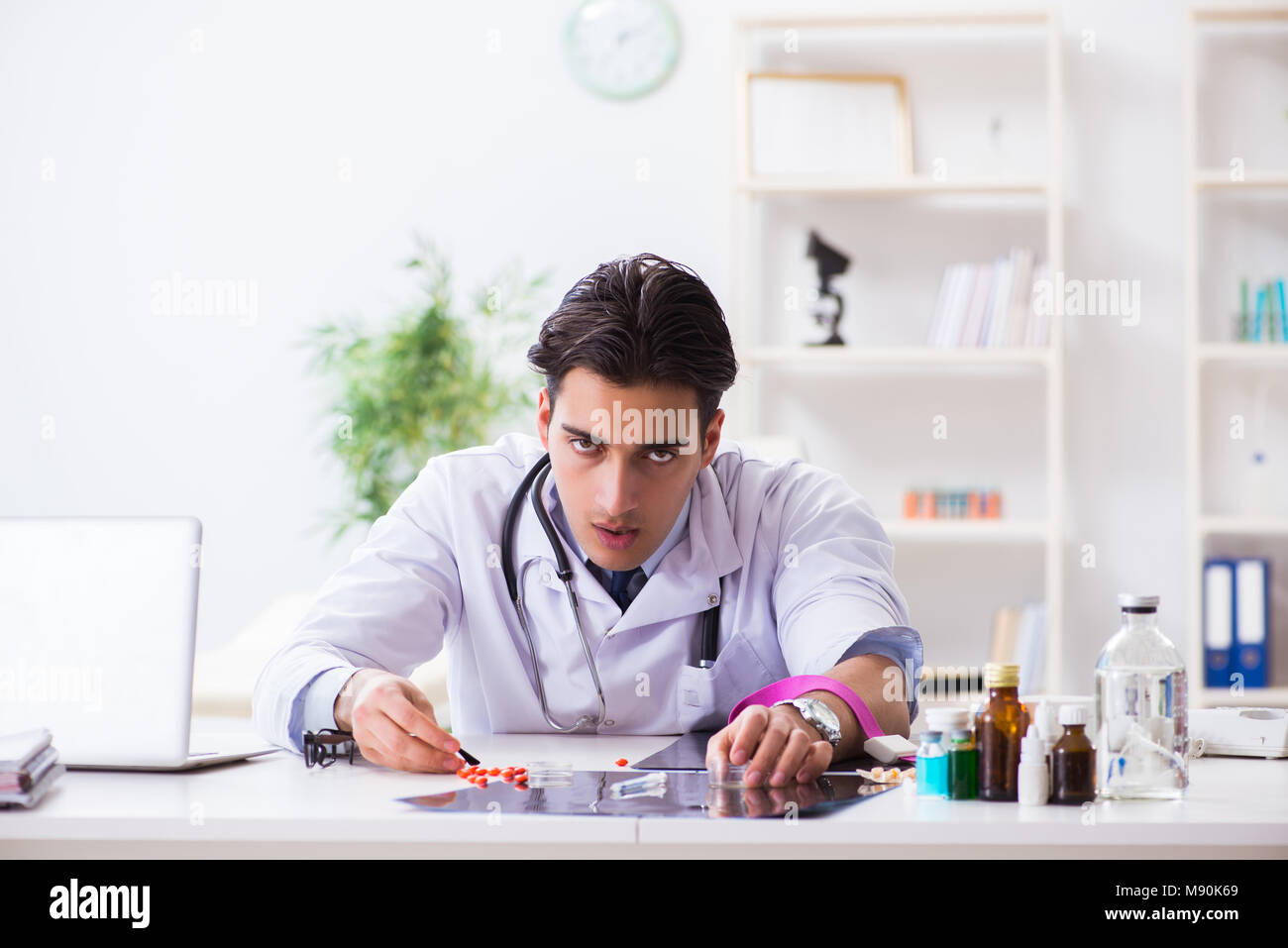 Doctor drug addict in the hospital Stock Photo - Alamy