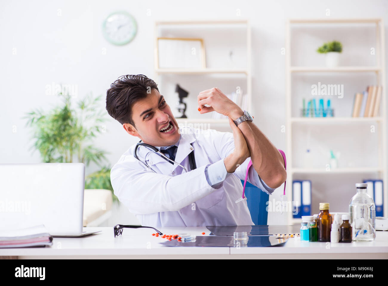 Doctor drug addict in the hospital Stock Photo - Alamy