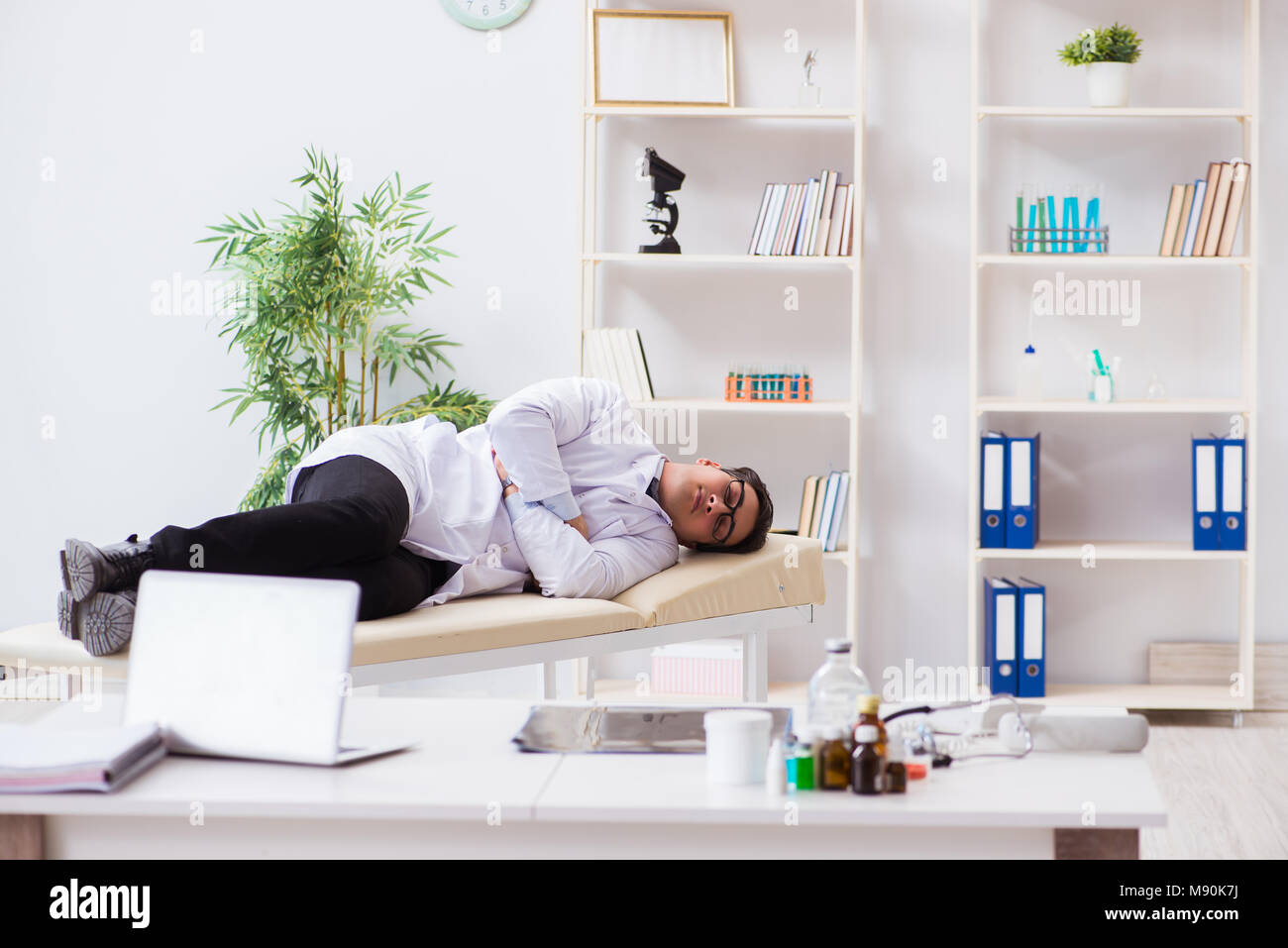 Doctor relaxing after complex surgery in hospital Stock Photo - Alamy