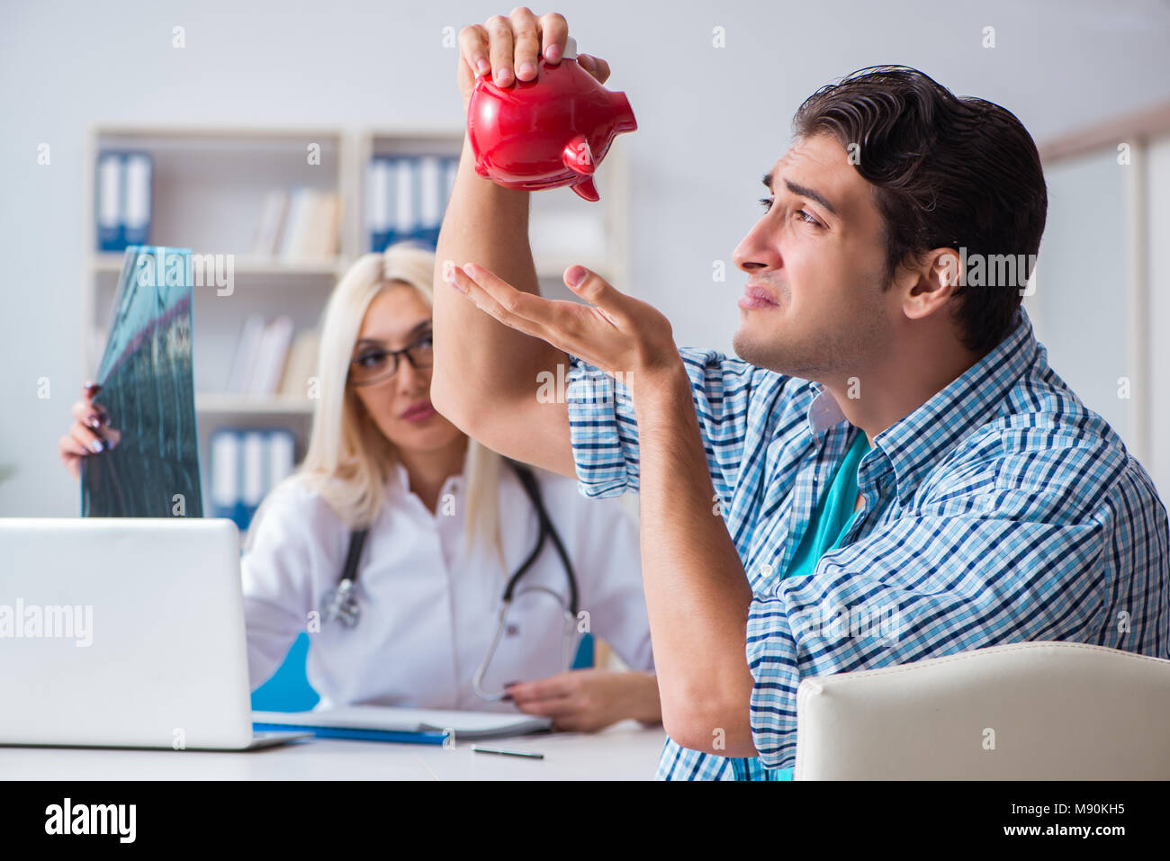 Male patient angry at expensive healthcare bill Stock Photo - Alamy