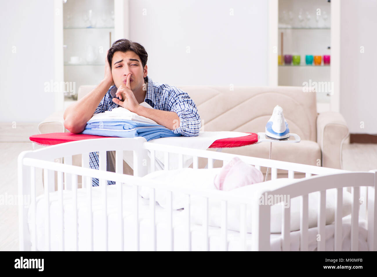 Young dad looking after newborn baby Stock Photo - Alamy
