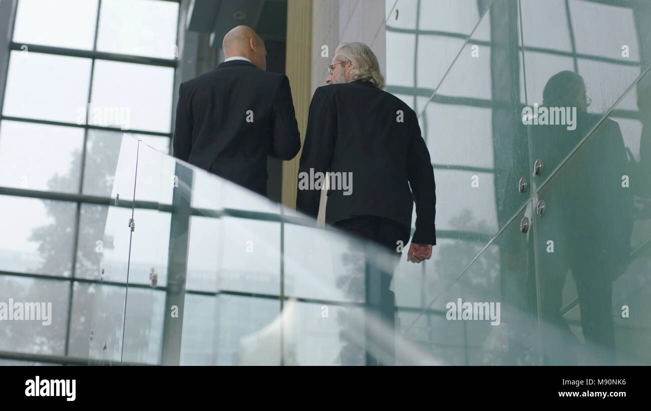 Business man back stairs hi-res stock photography and images - Alamy