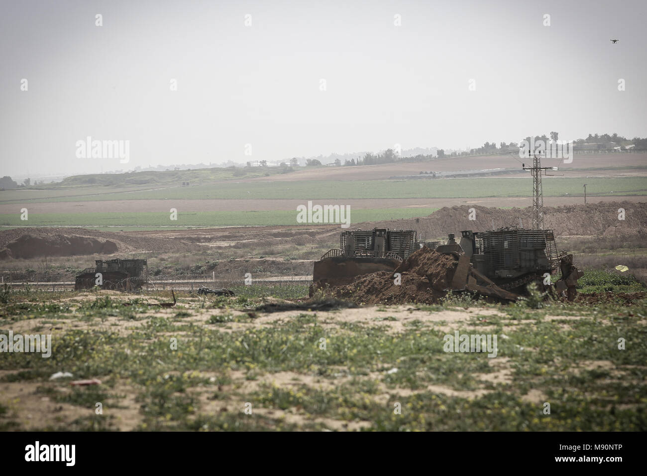 Jabalya, Gaza. 20th Mar, 2018. An Israeli D9 bulldozer patrols along ...