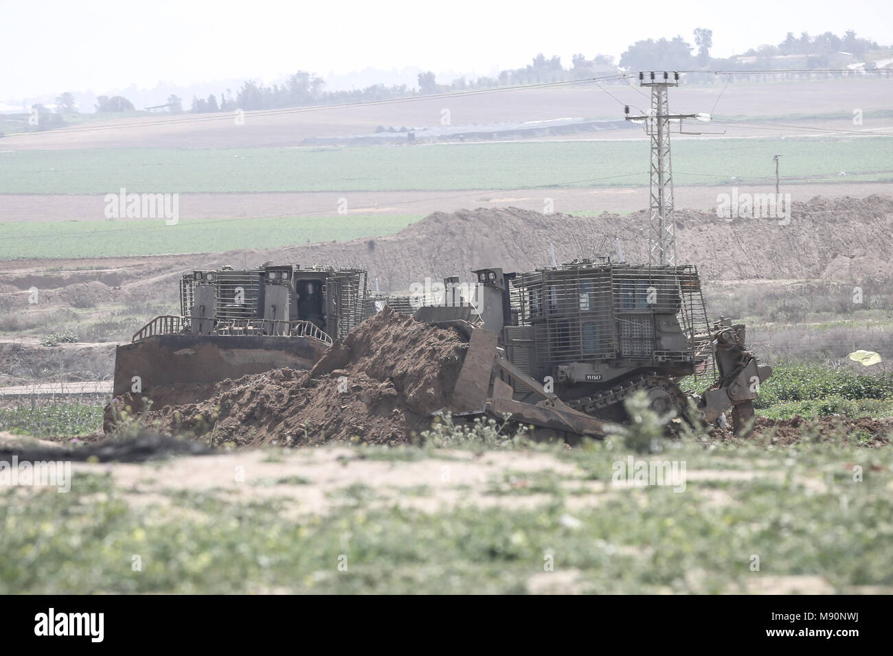 Jabalya, Gaza. 20th Mar, 2018. An Israeli D9 bulldozer patrols along ...