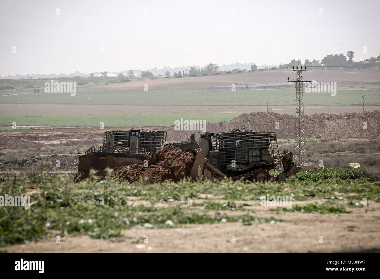 Jabalya, Gaza. 20th Mar, 2018. An Israeli D9 bulldozer patrols along ...