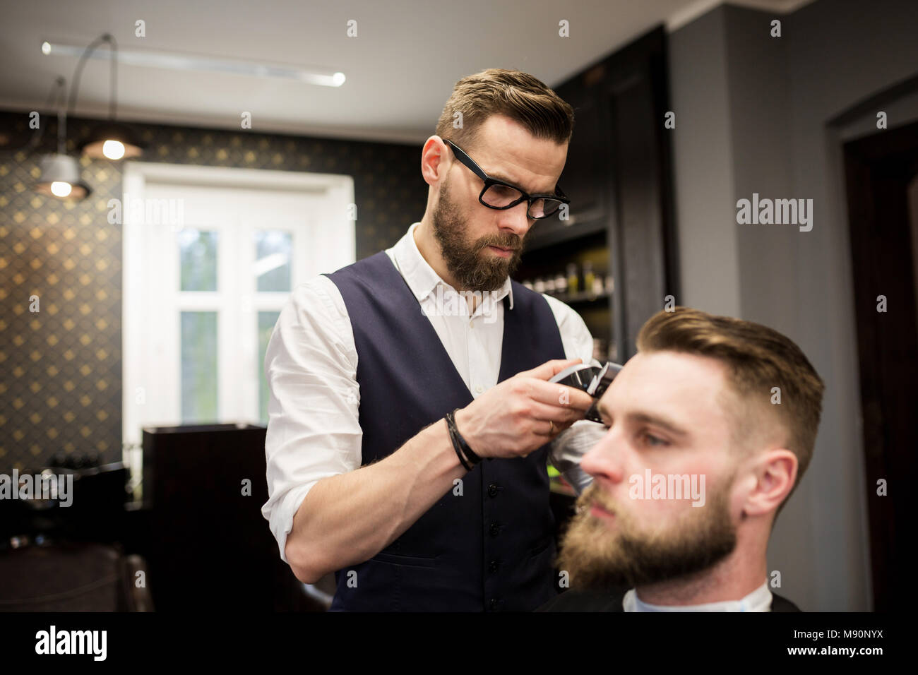 Inside busy barber shop hi-res stock photography and images - Alamy