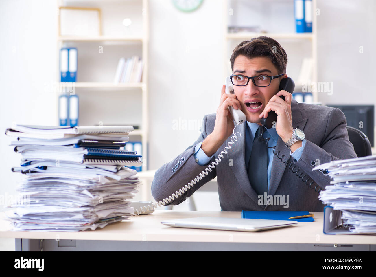 Desperate sad employee tired at his desk in call center Stock Photo - Alamy