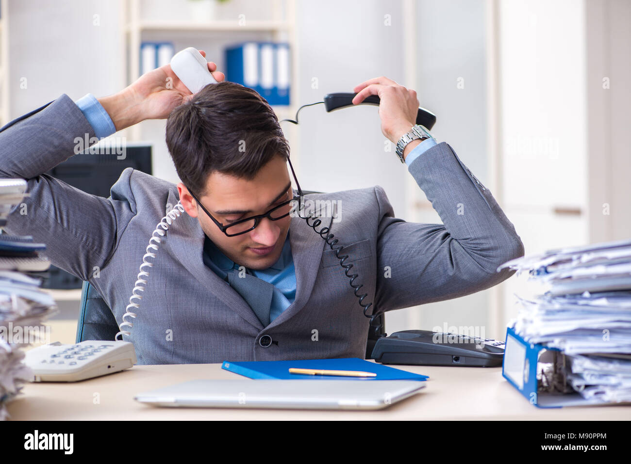 Desperate sad employee tired at his desk in call center Stock Photo - Alamy