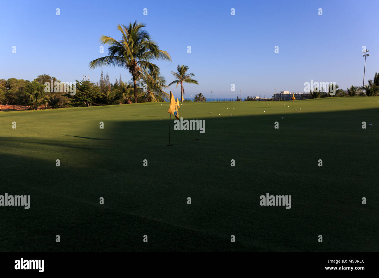 beautiful golf course at the ocean side at sunset, sunrise time ...