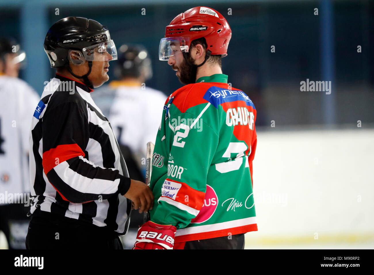 Ice Hockey. Player with referee Stock Photo - Alamy