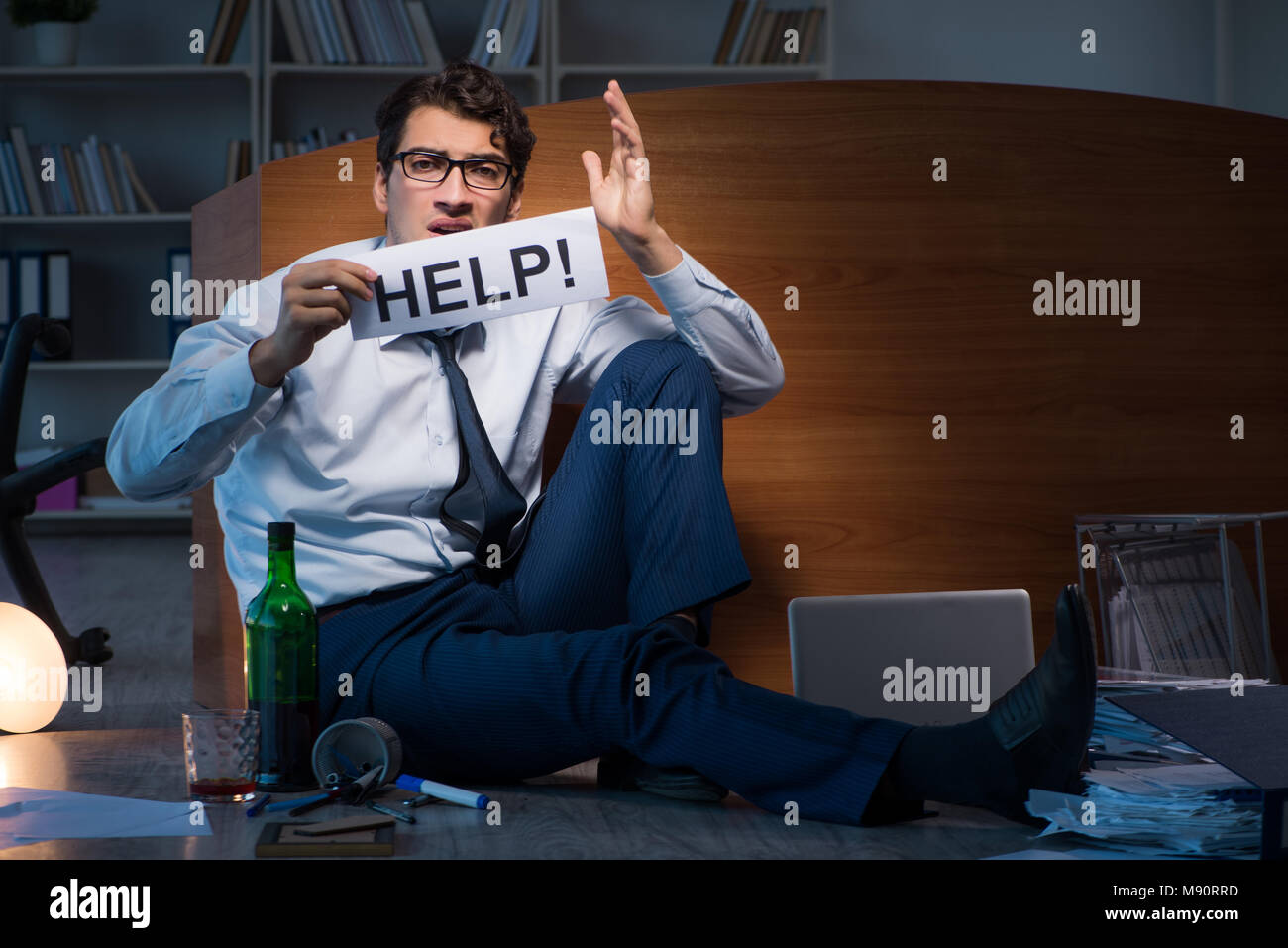 Employee asking for help and drinking under stress and despair Stock ...