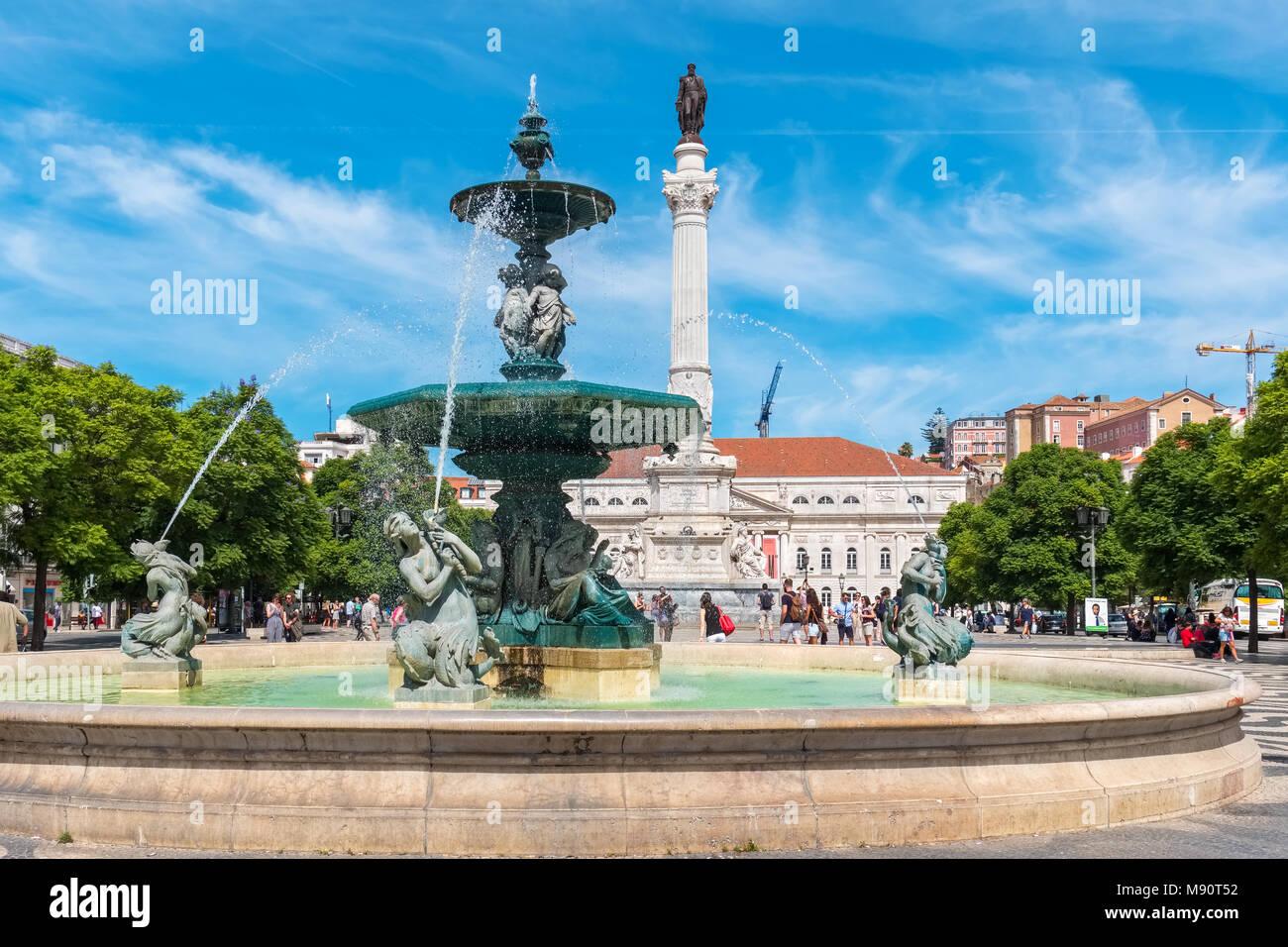 Fountain and Dom Pedro IV monument at Rossio Square. Lisbon, Portugal ...