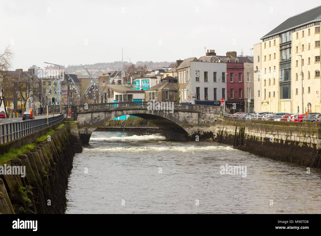 Parliament Bridge and the narrow streets of Cork Ireland on the Father ...