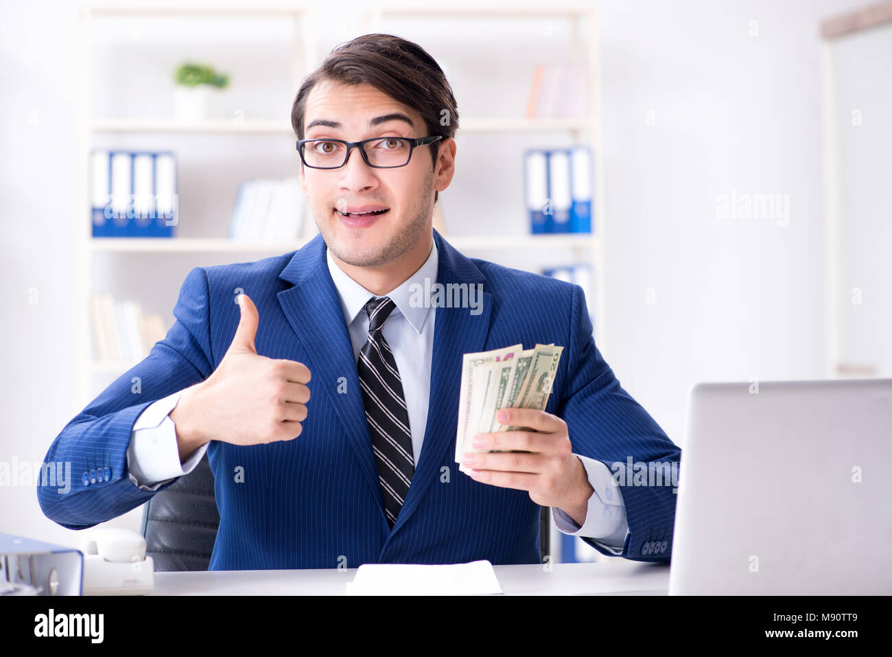 Businessman receiving his salary and bonus Stock Photo - Alamy