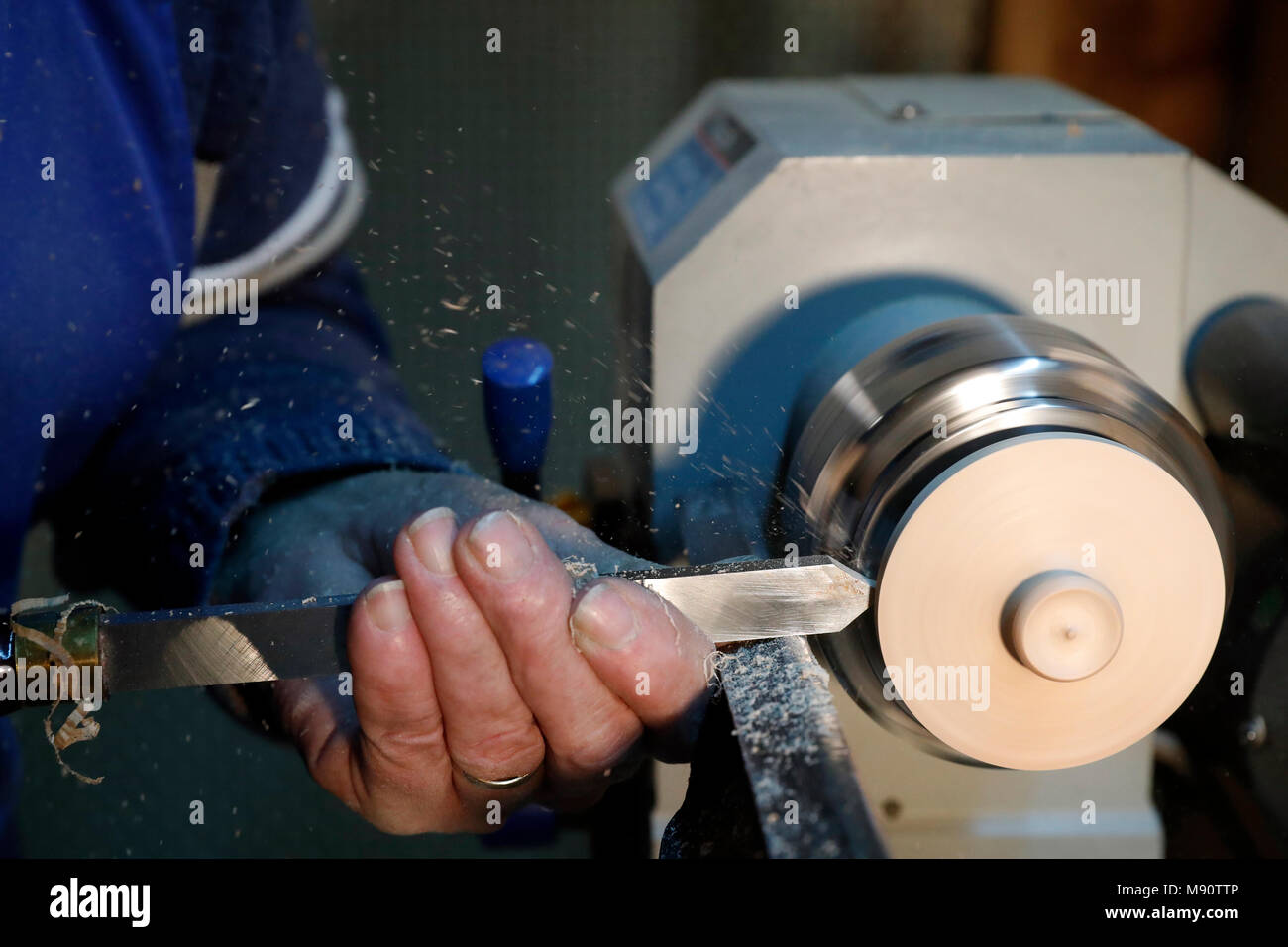 Man working on a wood lathe Stock Photo - Alamy
