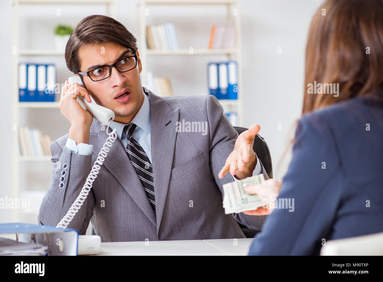 Businessman being offered bribe for breaking law Stock Photo - Alamy