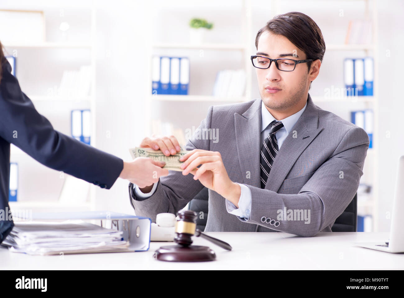 Lawyer being offered bribe for his services Stock Photo - Alamy